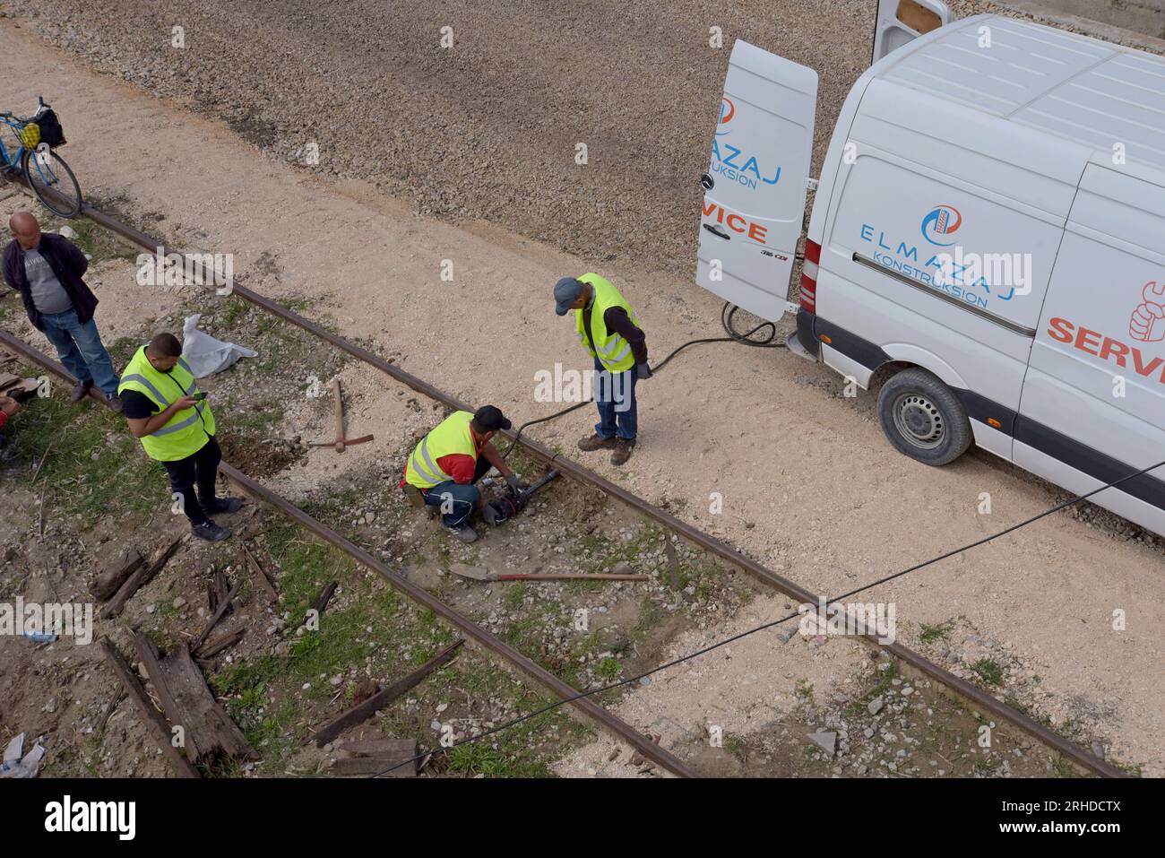 Construction workers using an oxy acetylene cutting torch to remove old ...