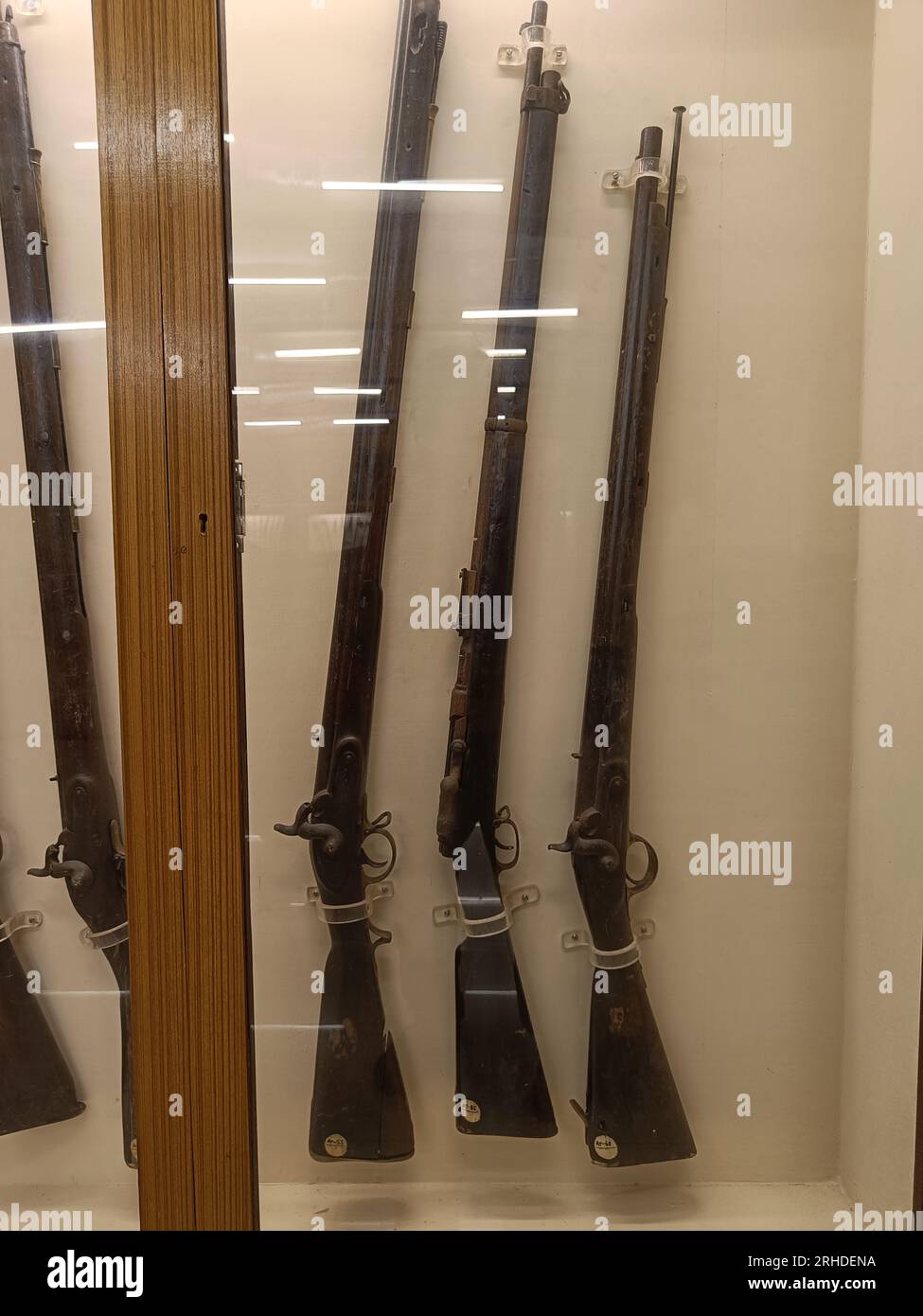 A few rifles that show a variety of guns such as flintlock; musket ...