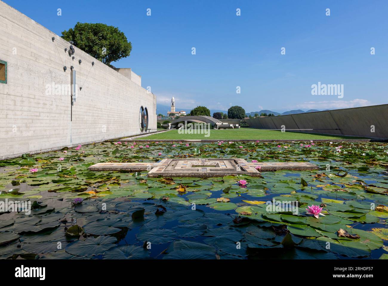 The meditation pavilion, surrounded by pools with plants and water ...