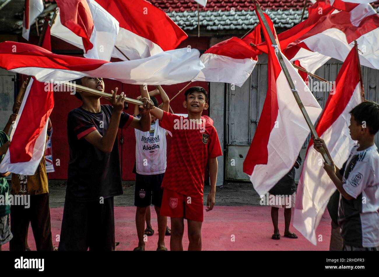 Jakarta, Indonesia. 14th Aug, 2023. Children wave Indonesian national ...