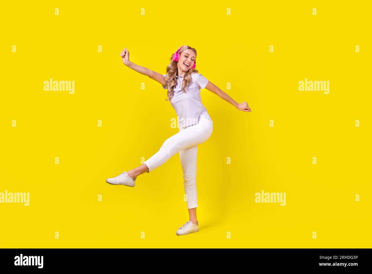 Full length photo of positive woman dressed purple t-shirt listen ...