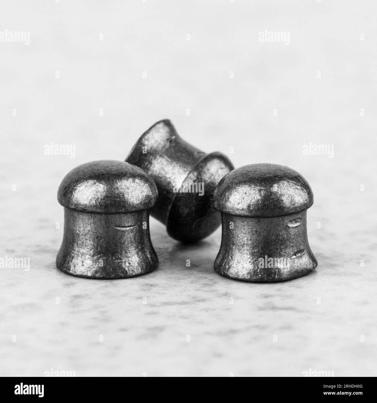 lead bullets for pneumatic weapons on a gray background close-up, black ...