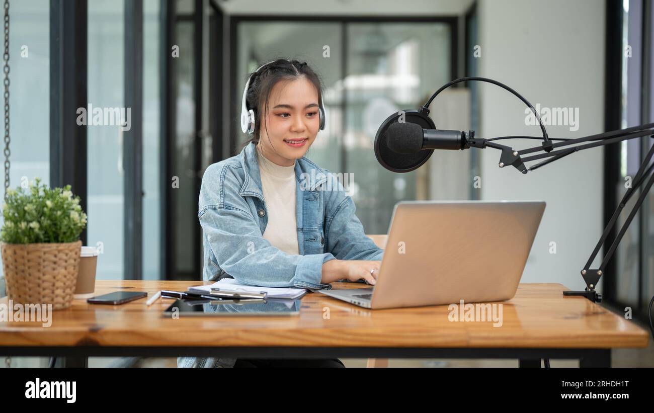 Speaking into a microphone recording hi-res stock photography and ...