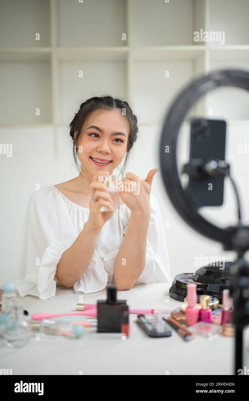 A beautiful and professional Asian female makeup artist or beauty ...