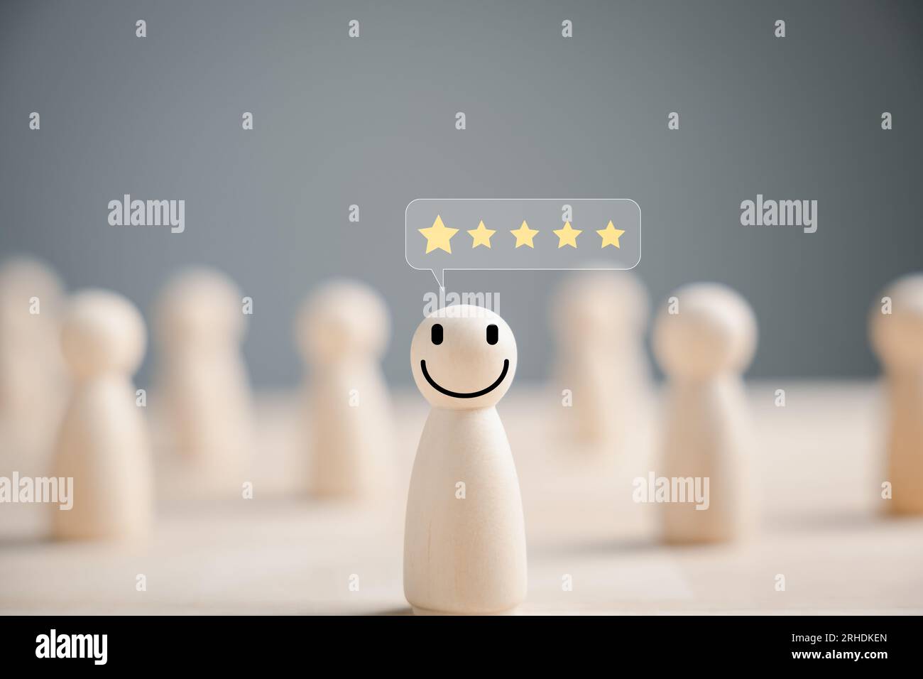 Hand choosing a wooden figure as the chosen leader from the crowd Stock ...