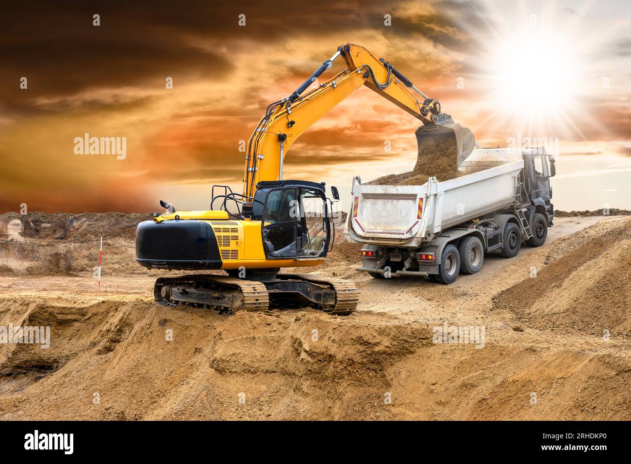 Excavator loading soil in truck hi-res stock photography and images - Alamy