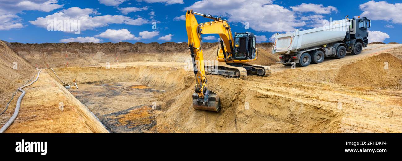Excavator loading soil in truck hi-res stock photography and images - Alamy