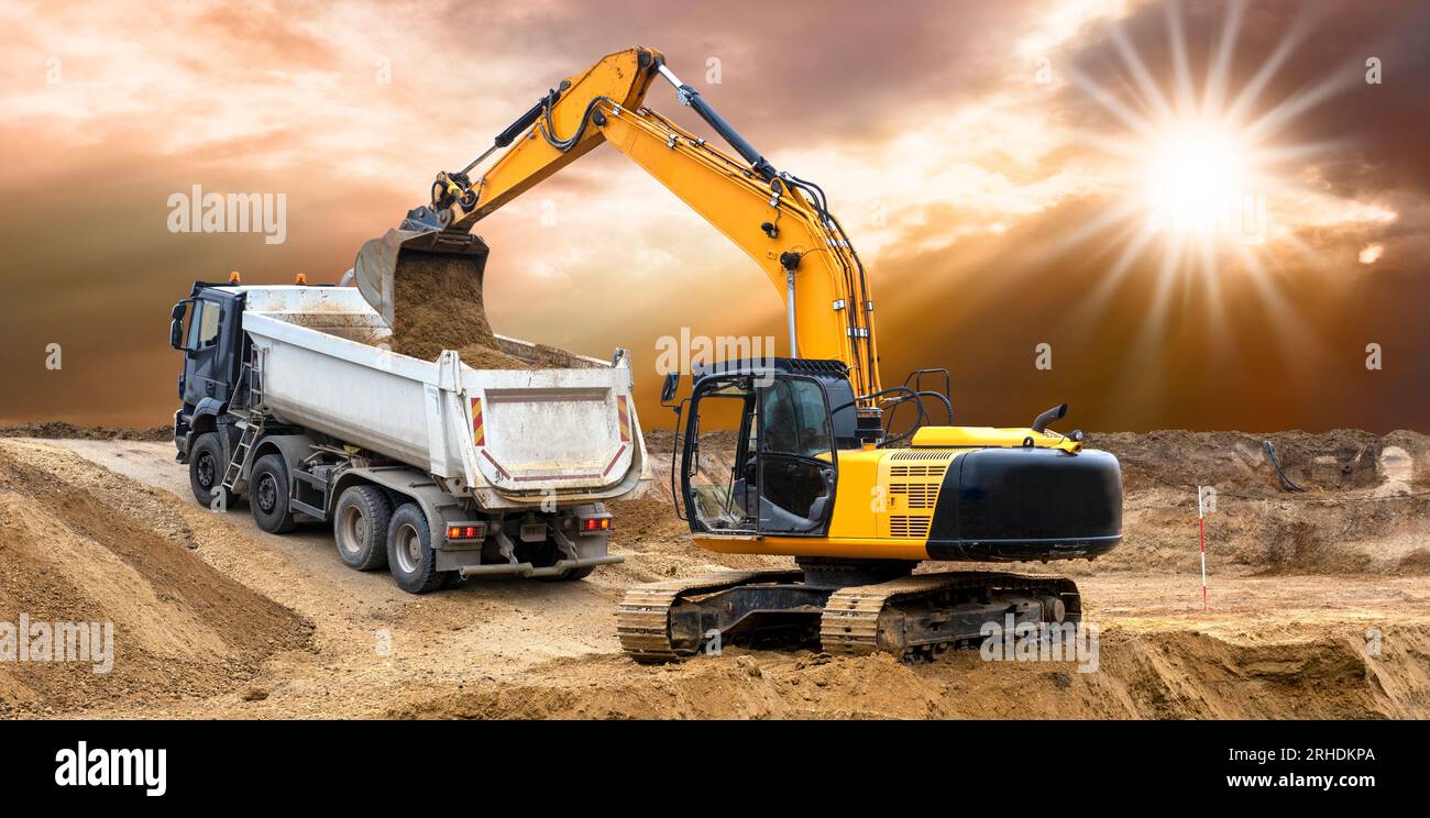 Excavator loading soil in truck hi-res stock photography and images - Alamy