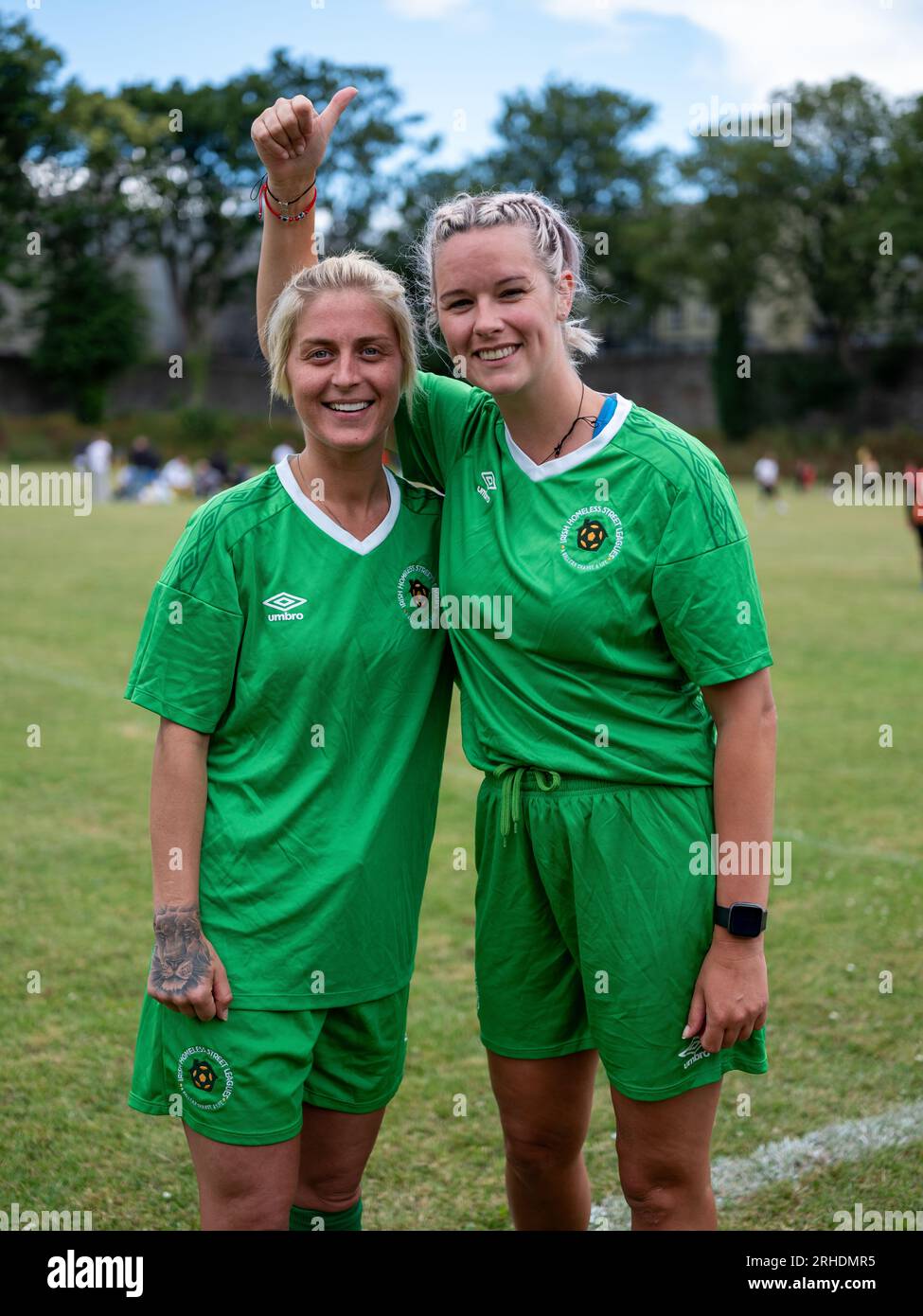 Portrait of two smiling female footballers in Dublin city, Ireland ...