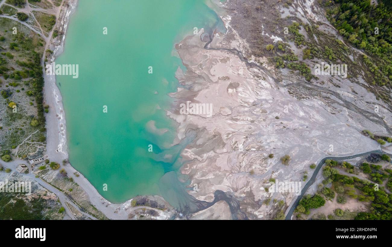 A mountain lake shore eroded by a mudflow. Wildlife Stock Photo - Alamy