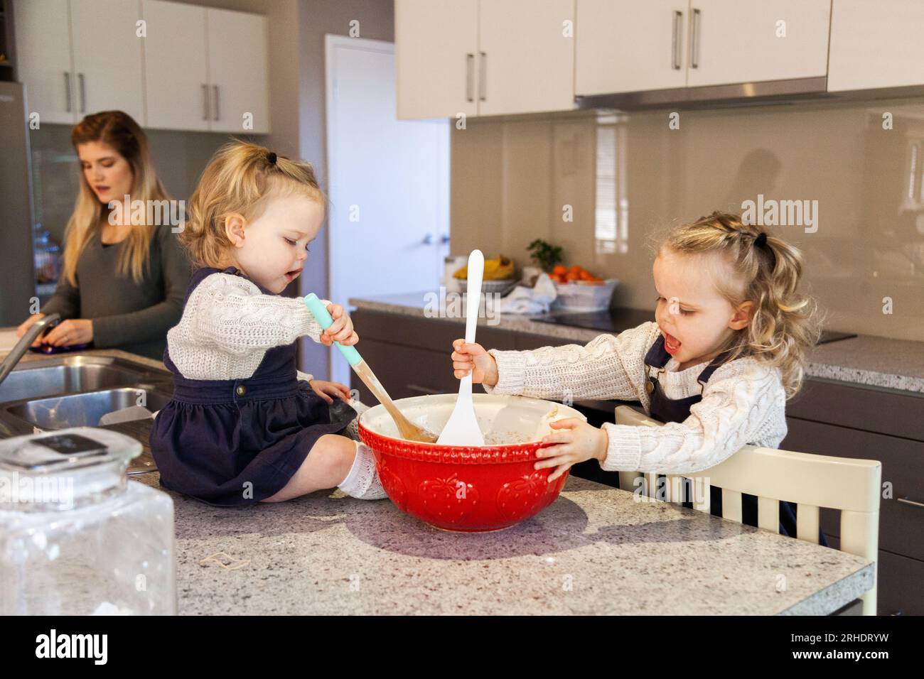 Children mixing ingredients together home hi-res stock photography and ...