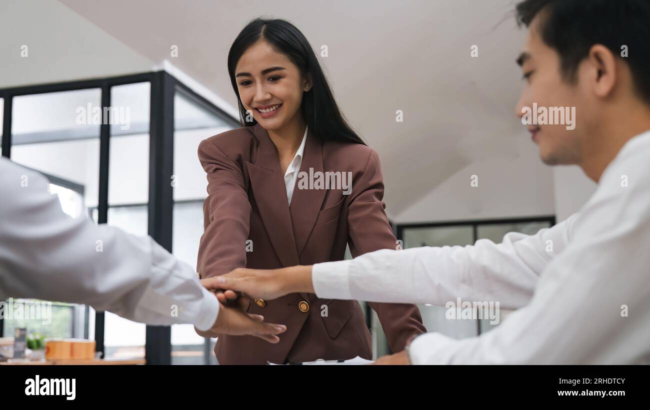 Business people stack touch arms palms together celebrating promotion ...