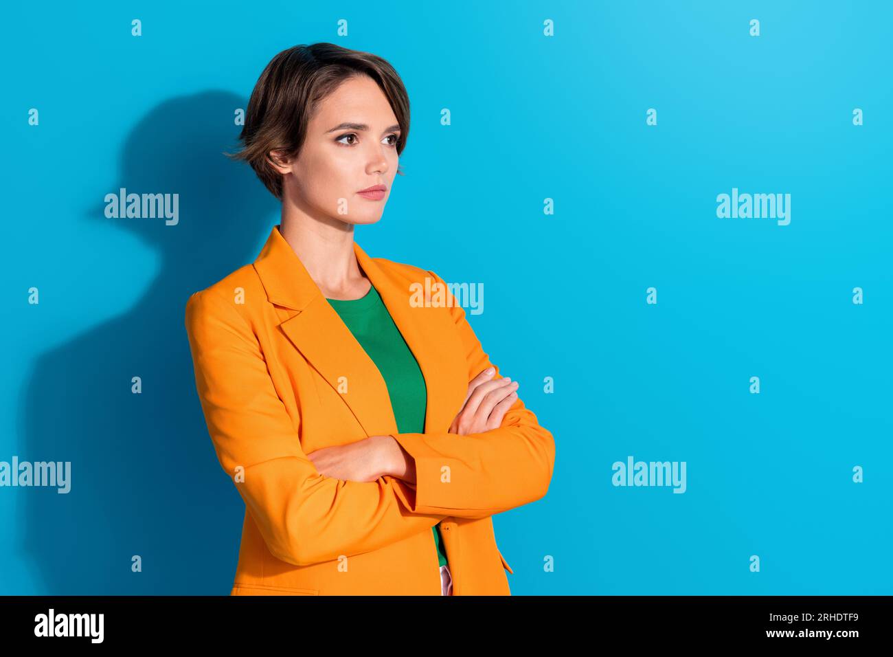Photo of young charming confident lady folded arms looking empty space ...