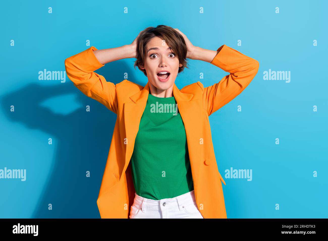 Photo nice young woman staring confused impressed reaction her business ...