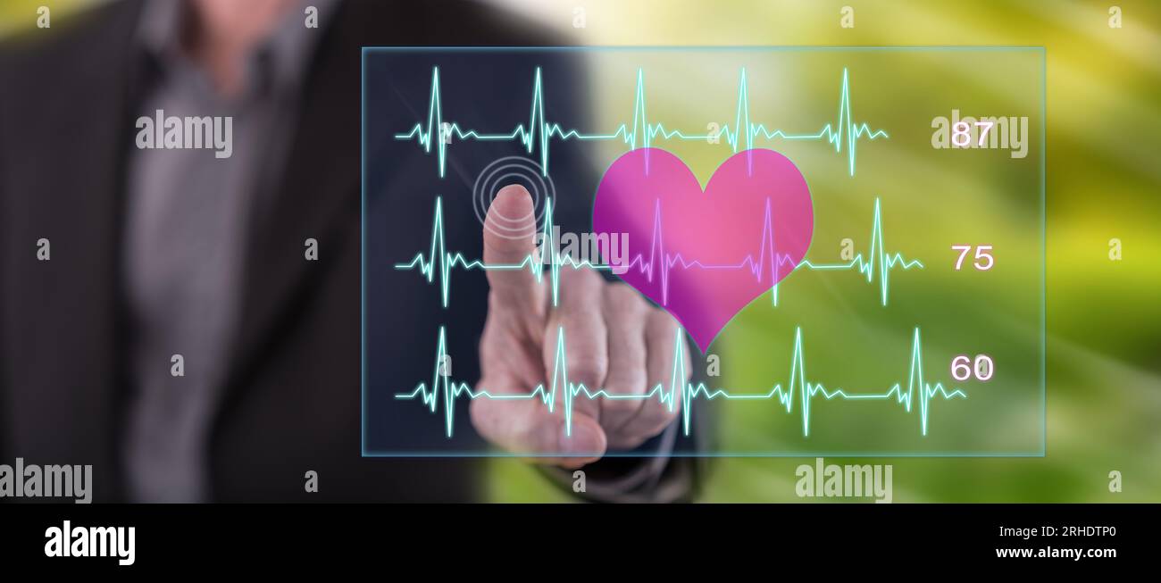 Man touching a heart beats graph concept on a touch screen with his ...