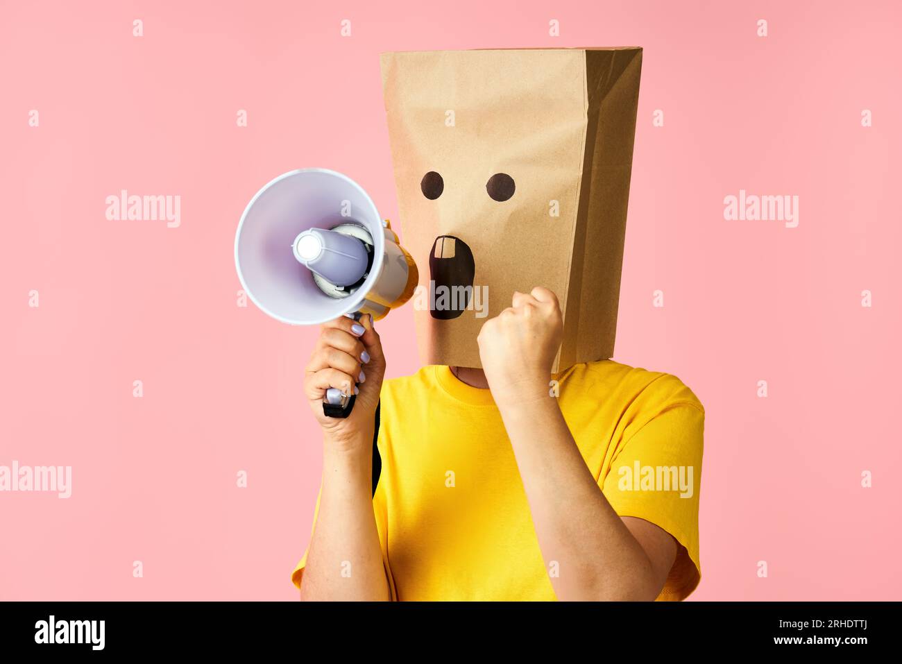Emotional woman with paper bag on head making announcement with ...