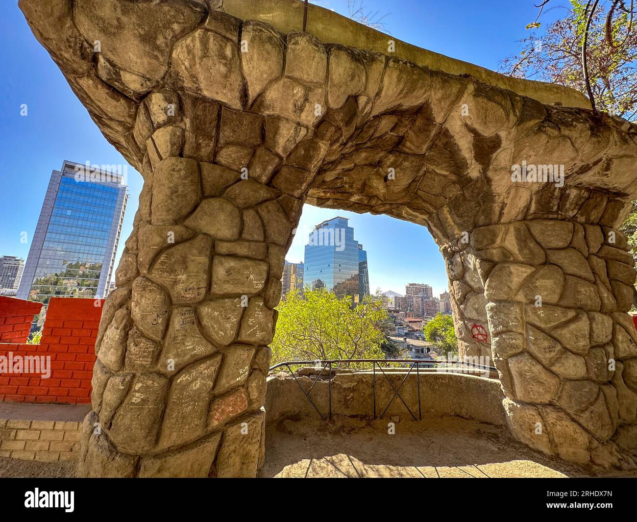 High-rise buildings viewed through the artificial stone arch on the ...
