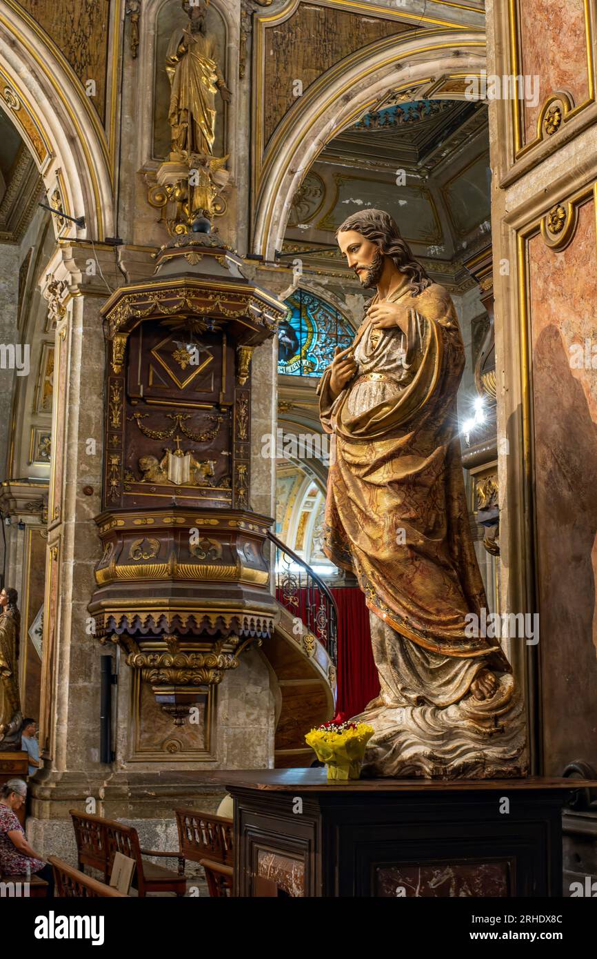 Statue of Christ and pulpit in the central nave of the Metropolitan ...