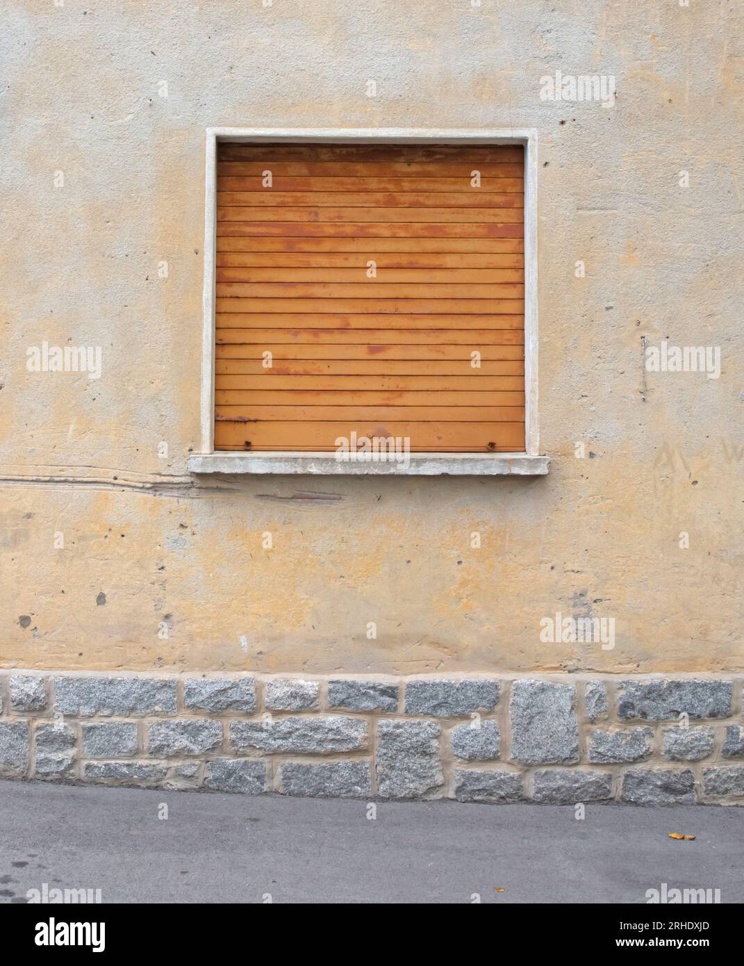 Residential house protected by a metal shutter in front of a window ...