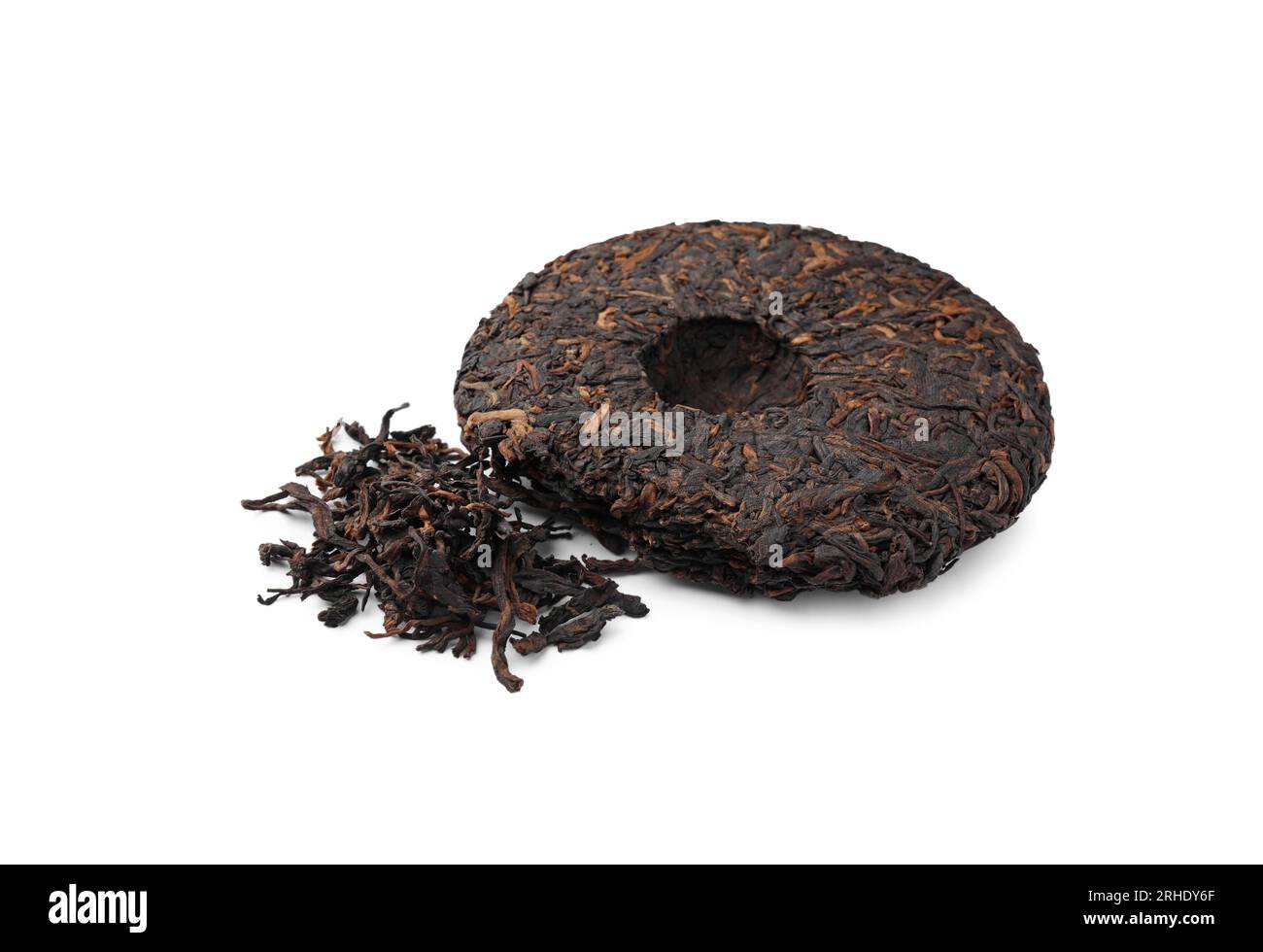 Broken disc shaped traditional Chinese pu-erh tea isolated on white ...