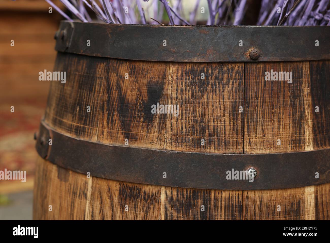 Traditional wooden barrel and decorative branches outdoors, closeup ...