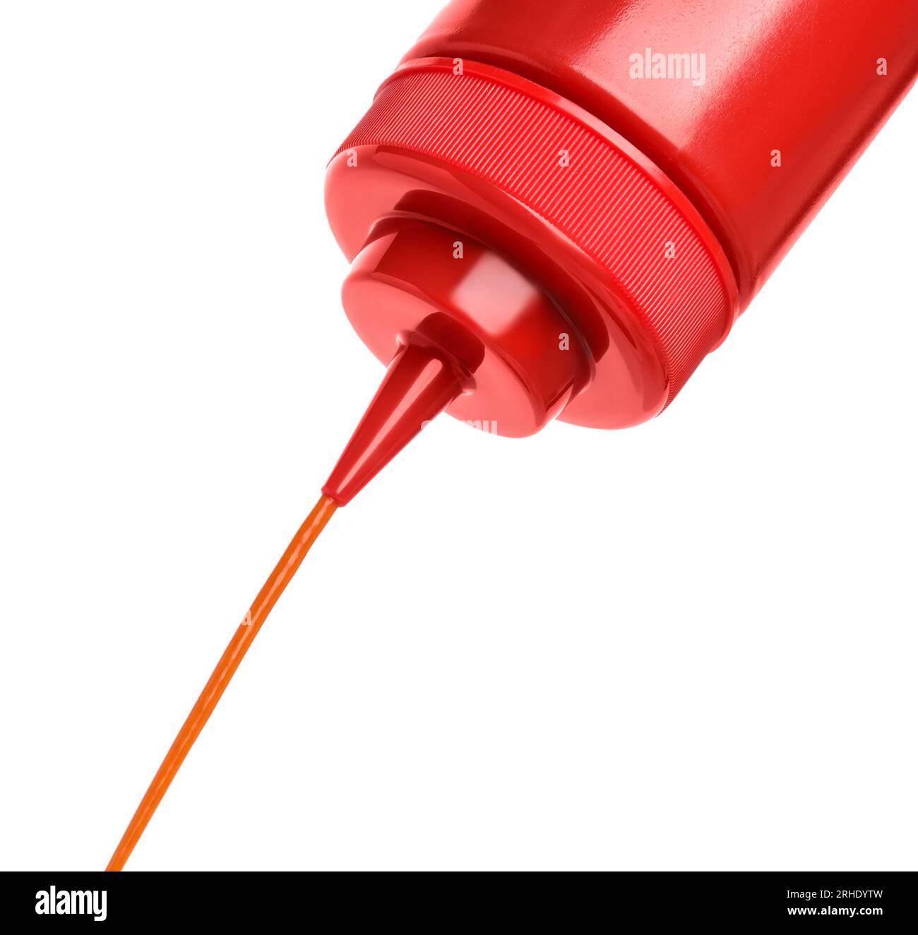 Pouring tasty red ketchup from bottle isolated on white Stock Photo - Alamy