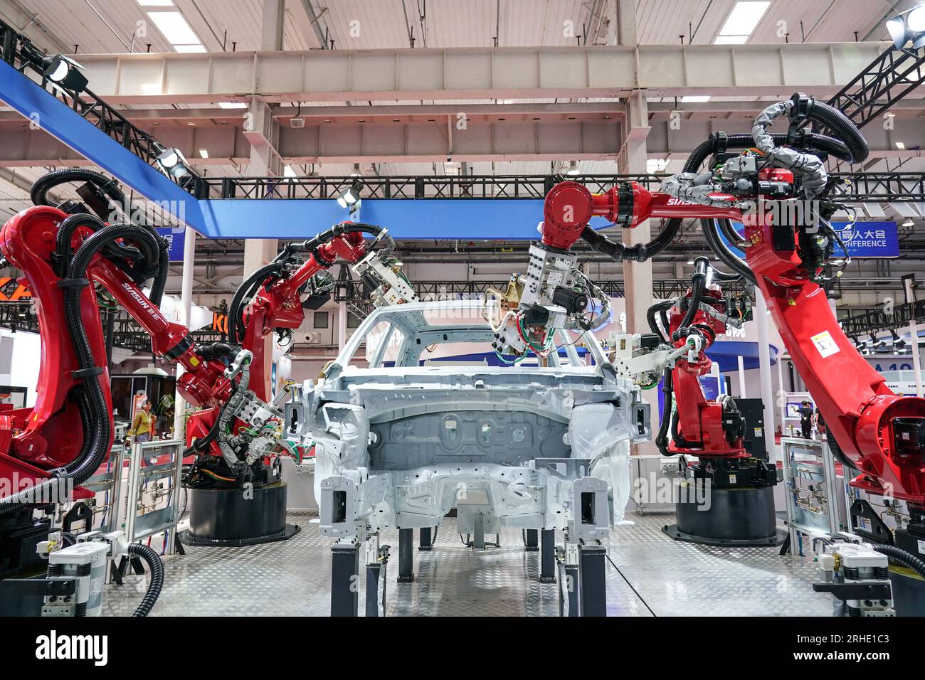 Beijing, China. 16th Aug, 2023. Welding robots are pictured at the ...