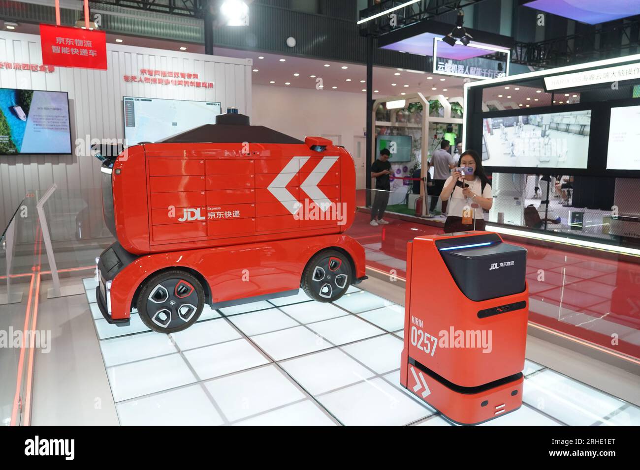 Beijing, China. 16th Aug, 2023. An indoor delivery robot (R) and a ...