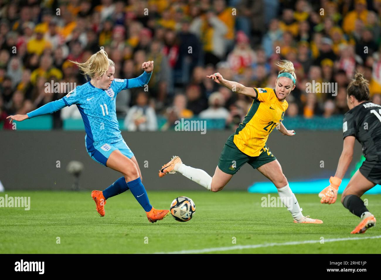 England's Lauren Hemp, left, scores her side's second goal past ...