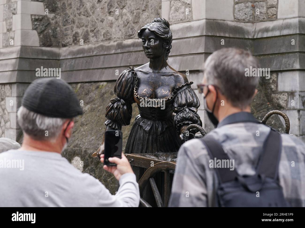 People take photographs of the iconic Molly Malone statue in Dublin's city centre after it was ...