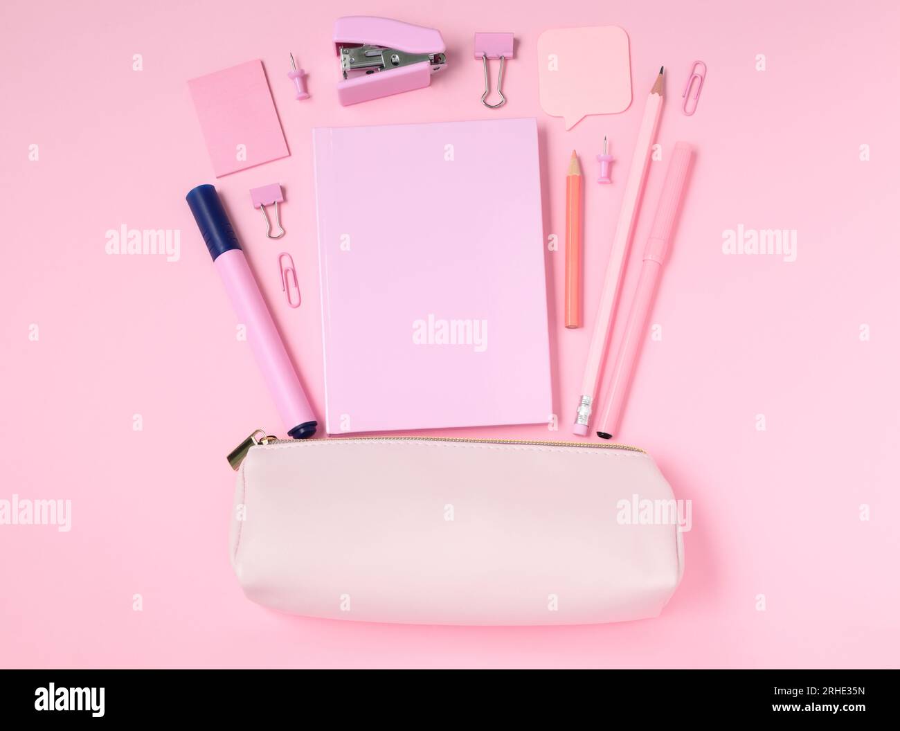 School and office supplies with pencil case on pink background ...
