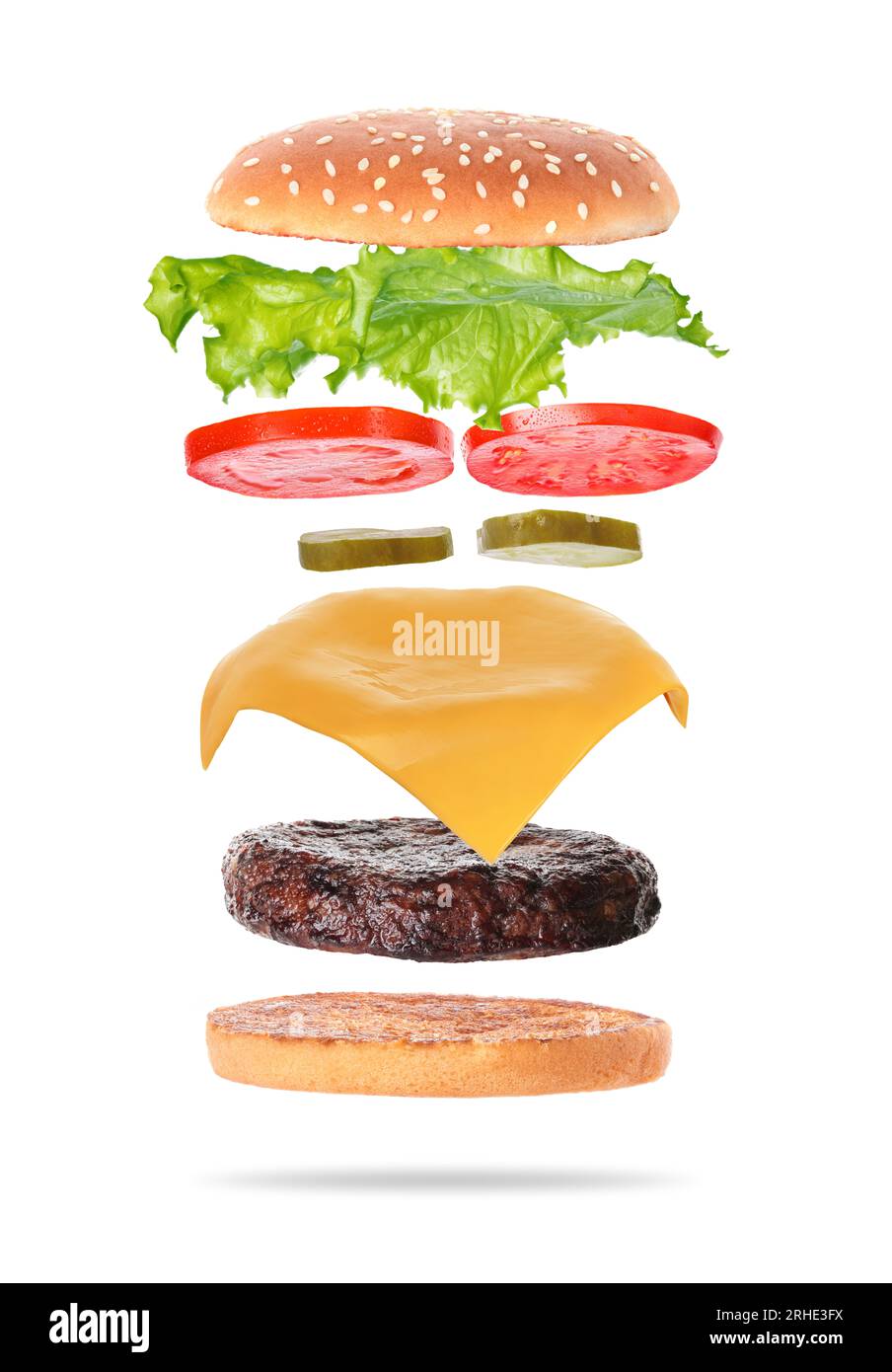 Parts of hamburger flying in the air on white background close-up Stock ...