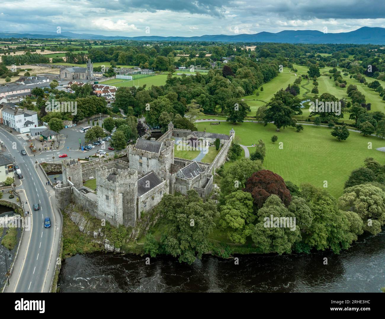 Aerial view of Cahir castle and town in Ireland with Tower House, outer ...