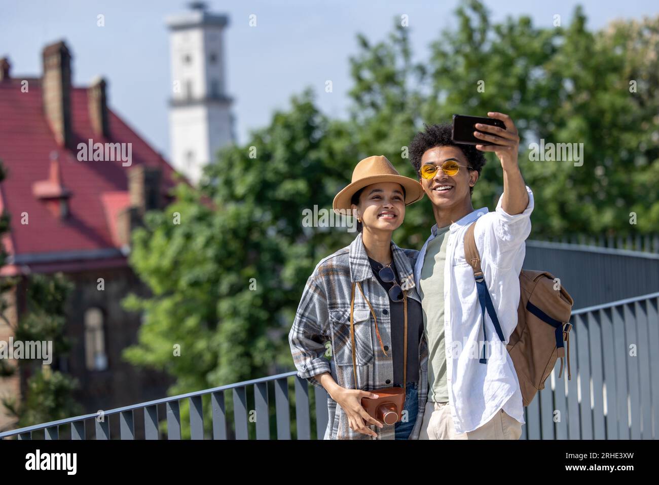 Young cute couple of tourists making selfie and smiling Stock Photo - Alamy