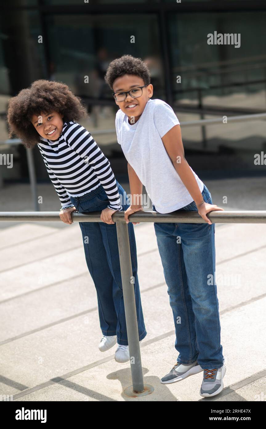 Children standing together in the street looking at camera Stock Photo ...