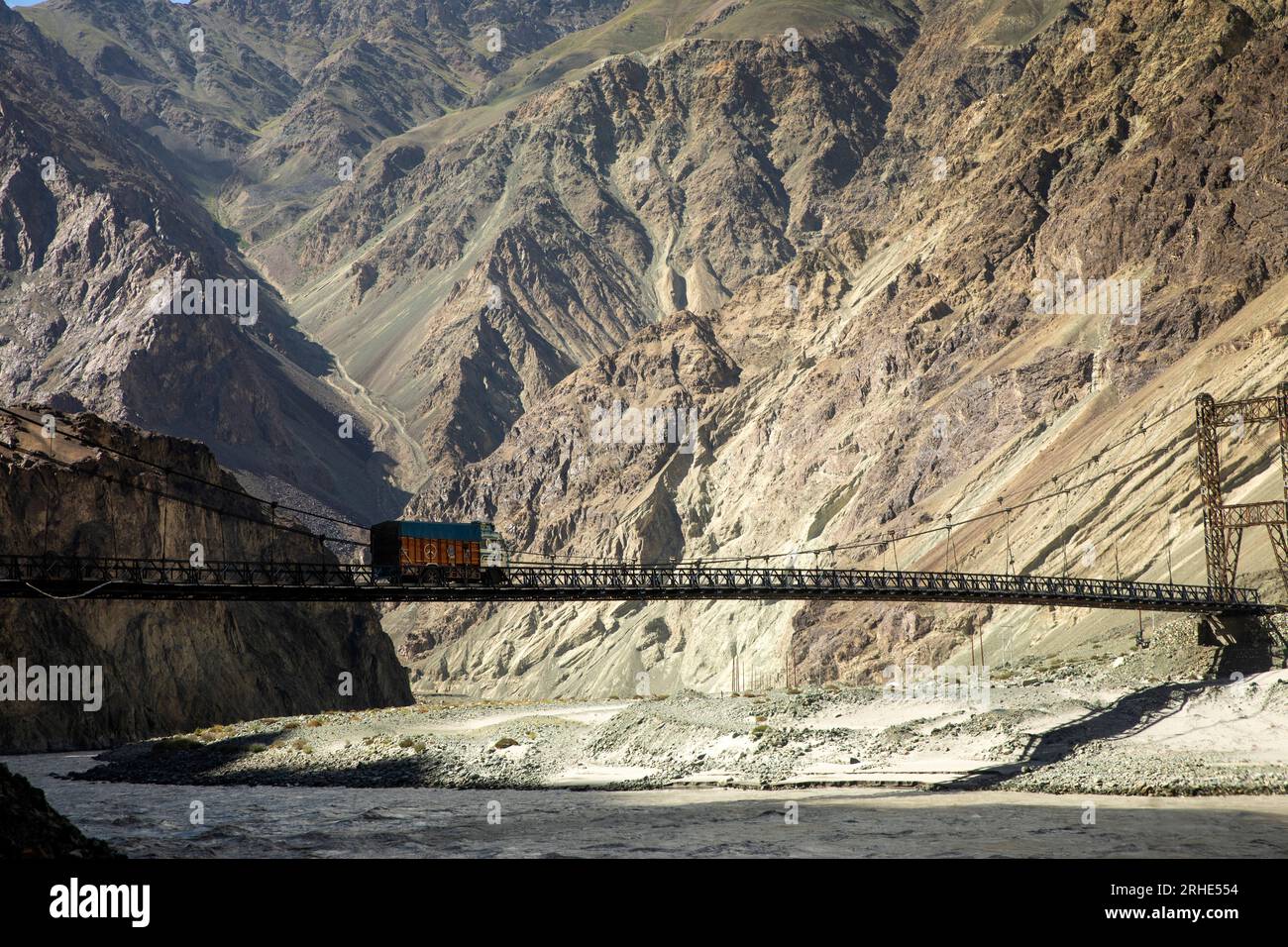India, Ladakh, Nubra Valley, Yagulung, truck crossing wooden suspension ...