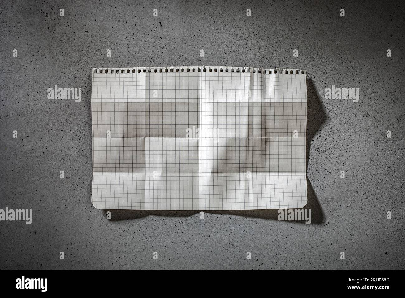 Crumpled notebook paper page on dark concrete backdrop surface. Paper ...
