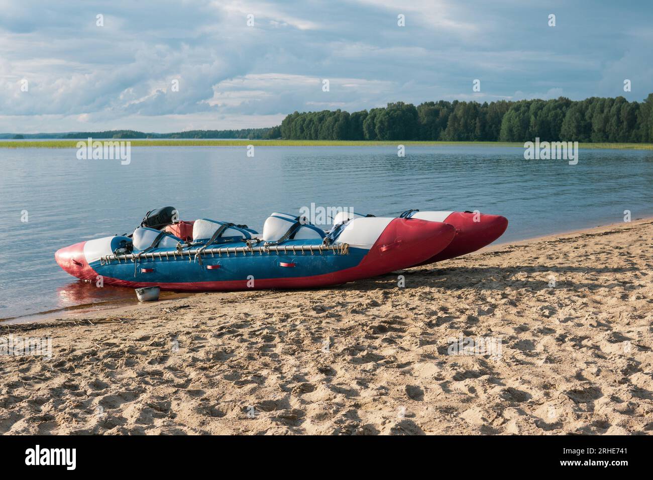 inflatable raft-catamaran for whitewater sports is moored on the river ...
