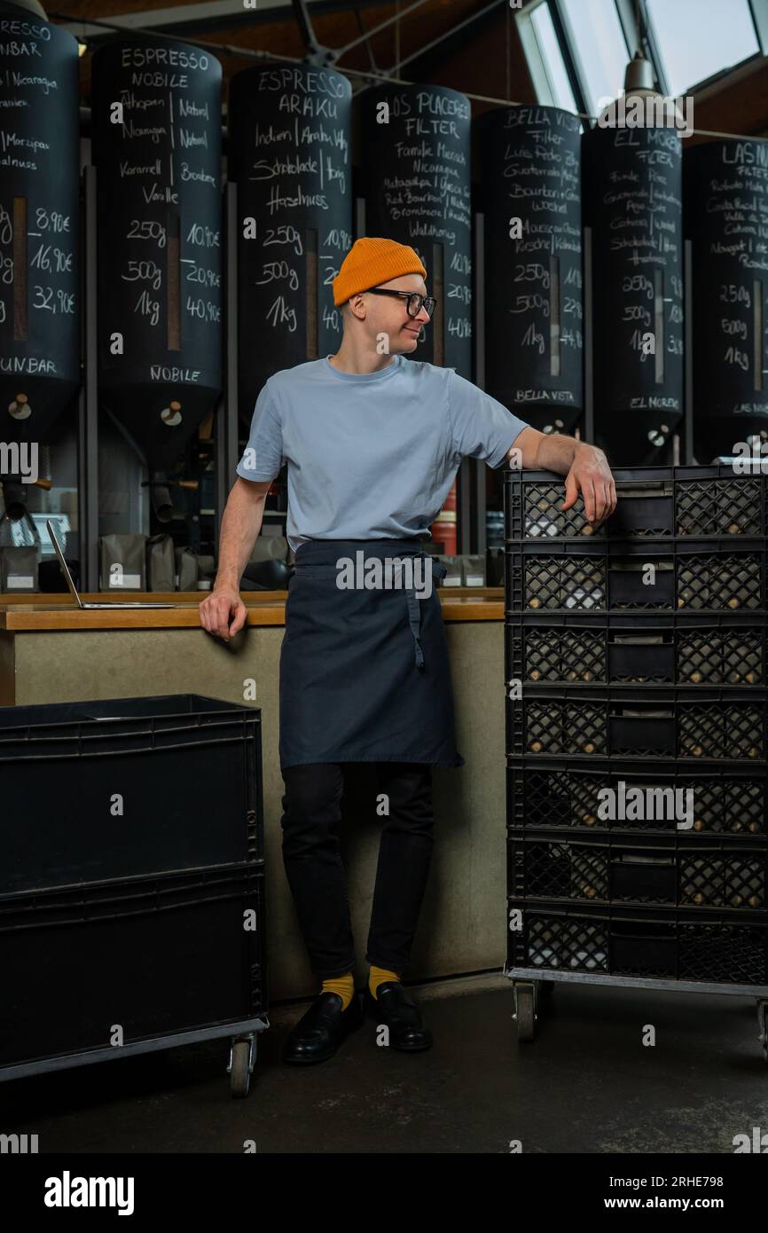 Barista accepts new batch of coffee unpacking boxes, preparing for ...