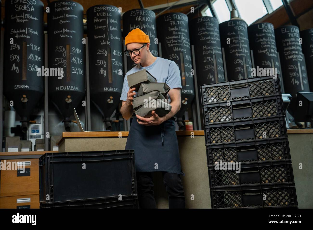 Barista accepts new batch of coffee unpacking boxes, preparing for ...