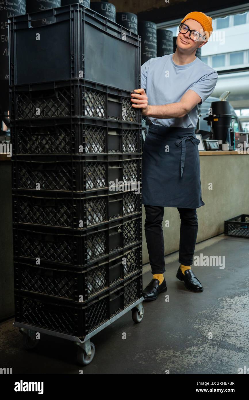 Barista accepts new batch of coffee unpacking boxes, preparing for ...