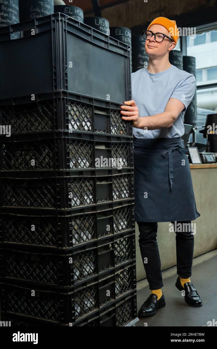 Barista accepts new batch of coffee unpacking boxes, preparing for ...