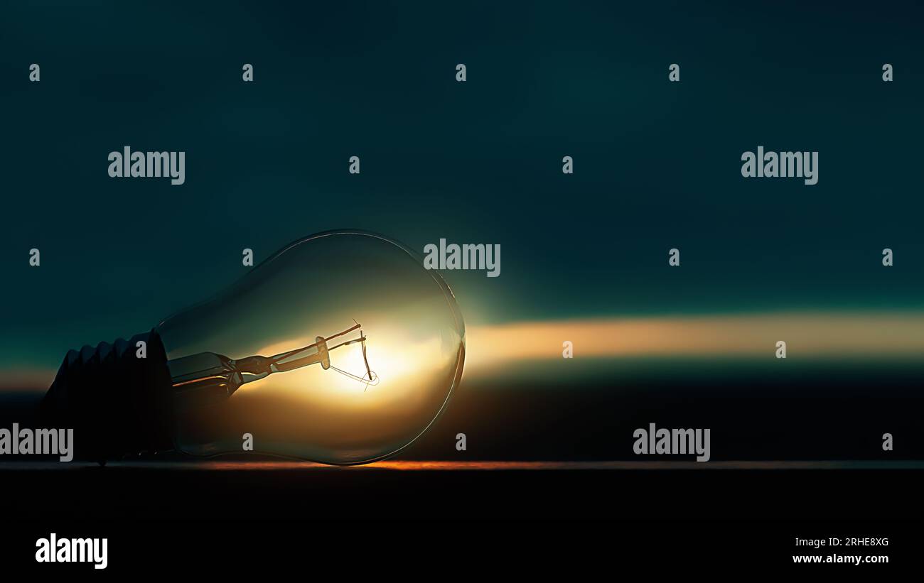 An electric lamp in the sunlight. Responsible energy consumption ...