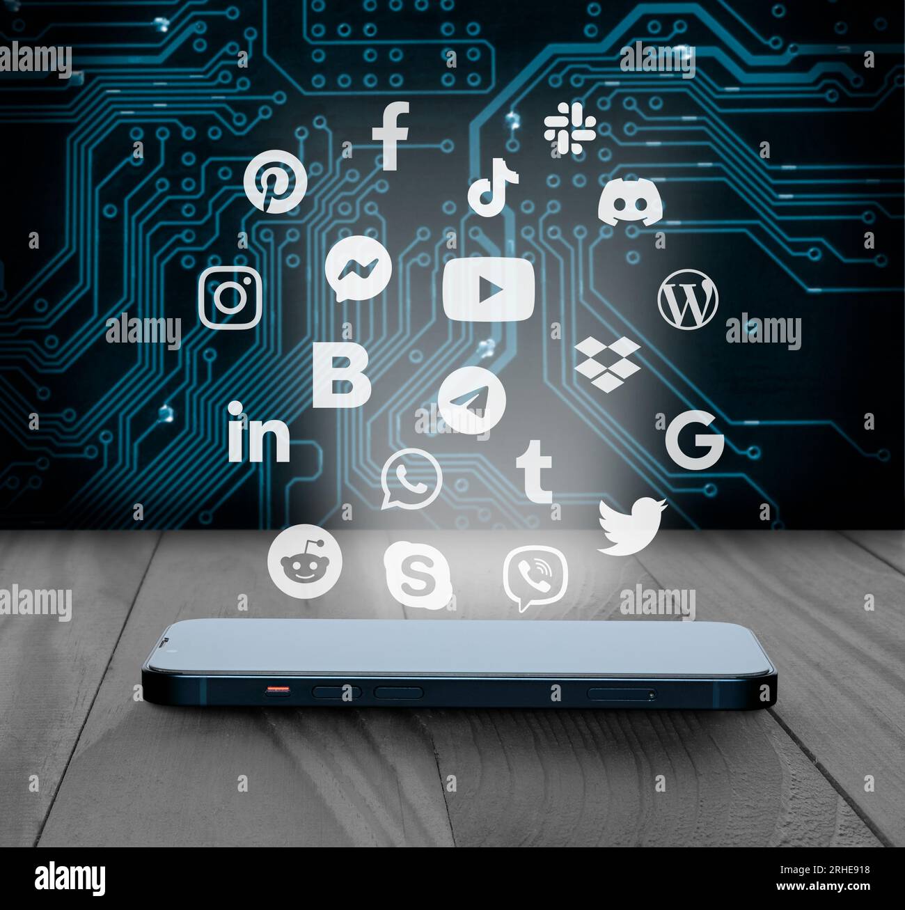 Smart phone on a dark vintage wood and digital background with flying ...