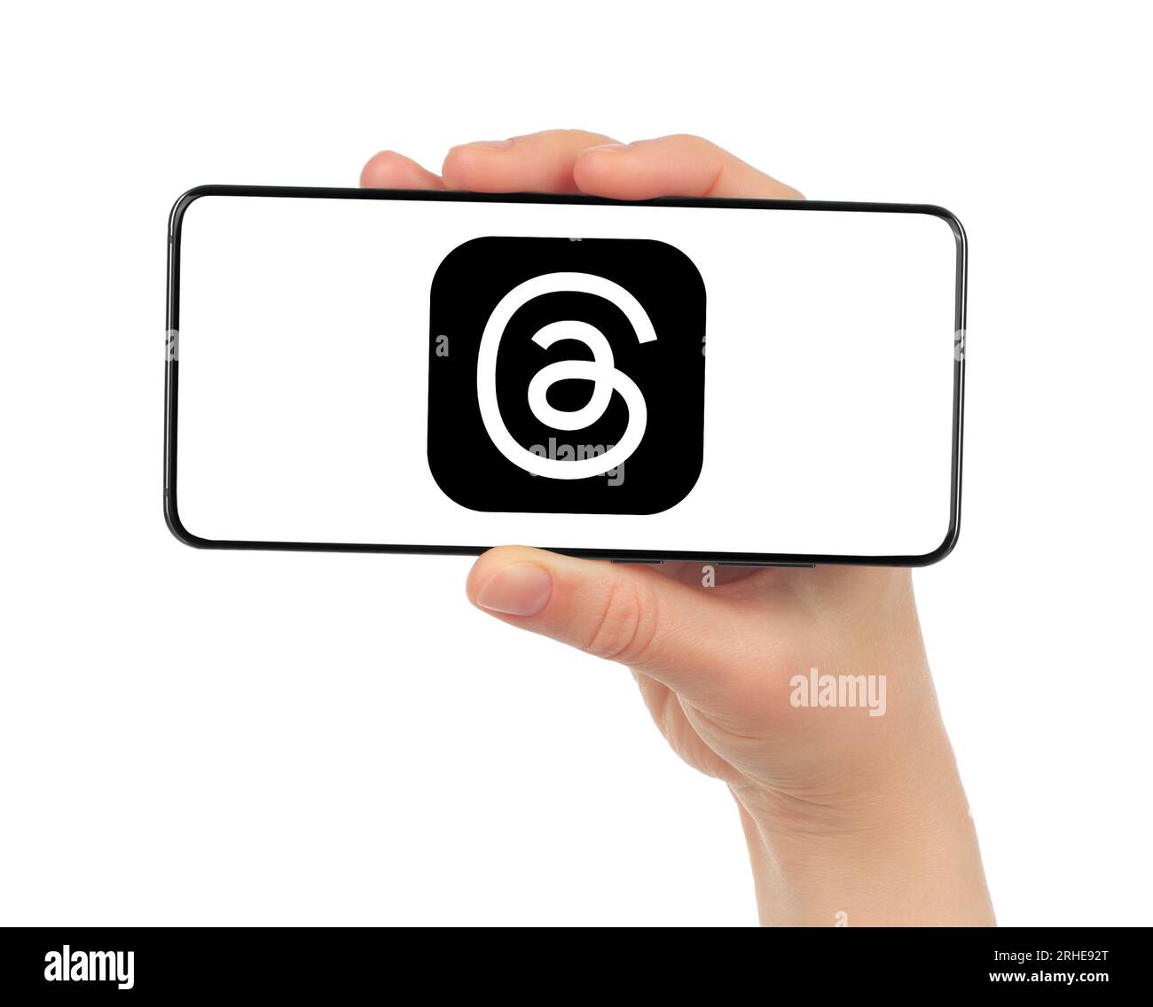 Woman hand holds smart phone with Threads mobile service icon on a ...