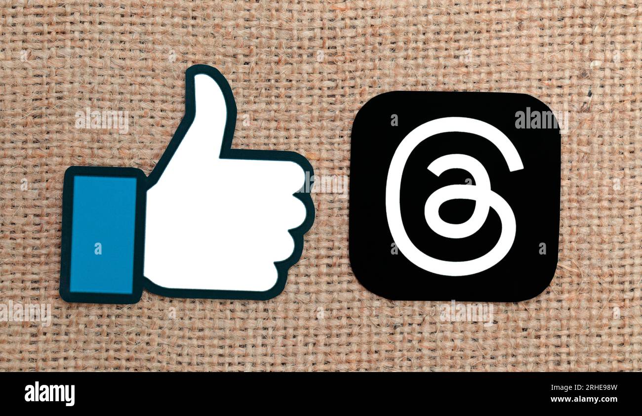 Threads mobile app icon and Facebook Like logo on a sackcloth textile ...