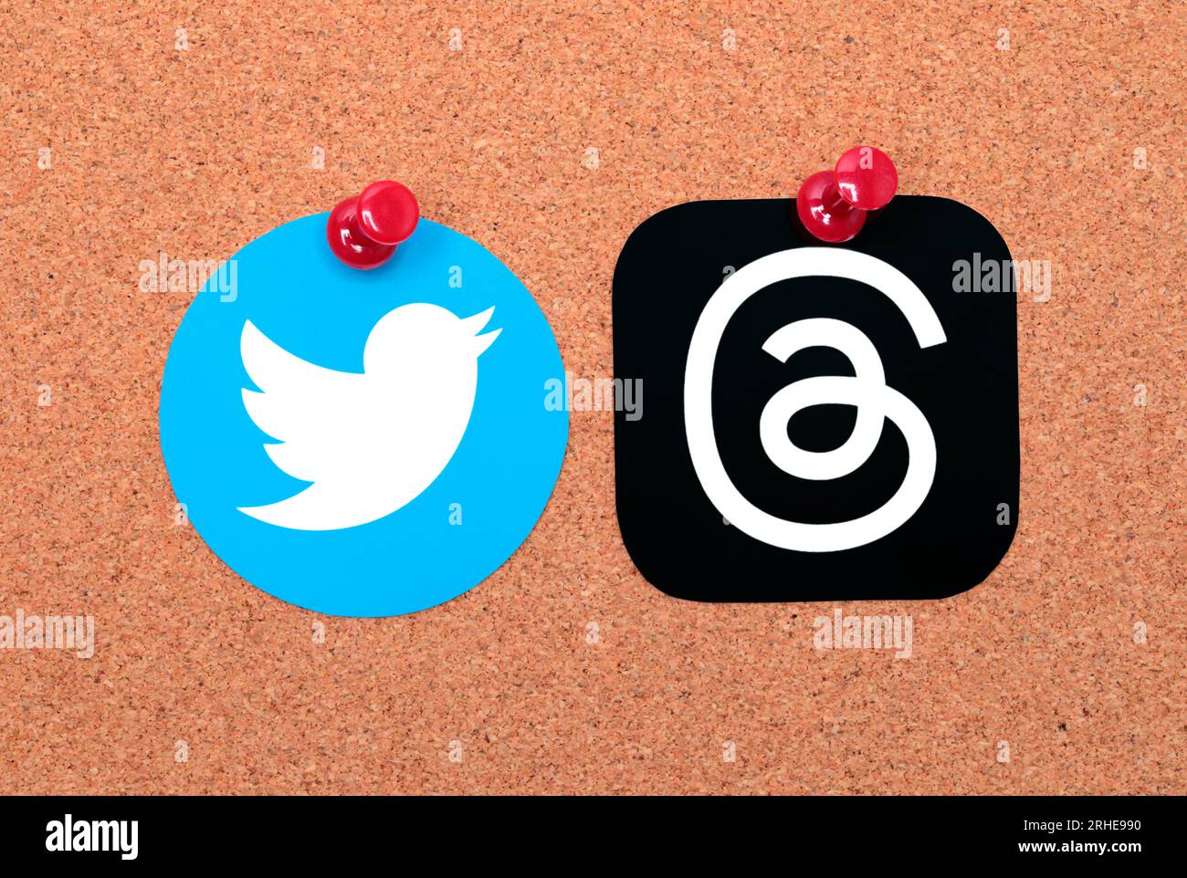 Threads mobile app icon and Twitter round icon pinned on cork tree ...