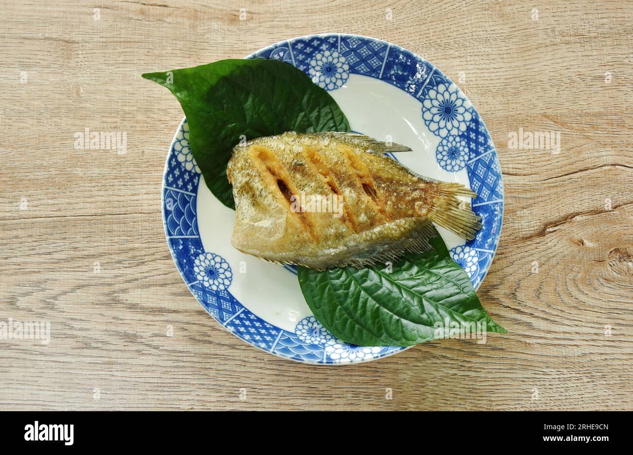 deep fried snake skin catfish or gourami on dish or gourami and fresh ...