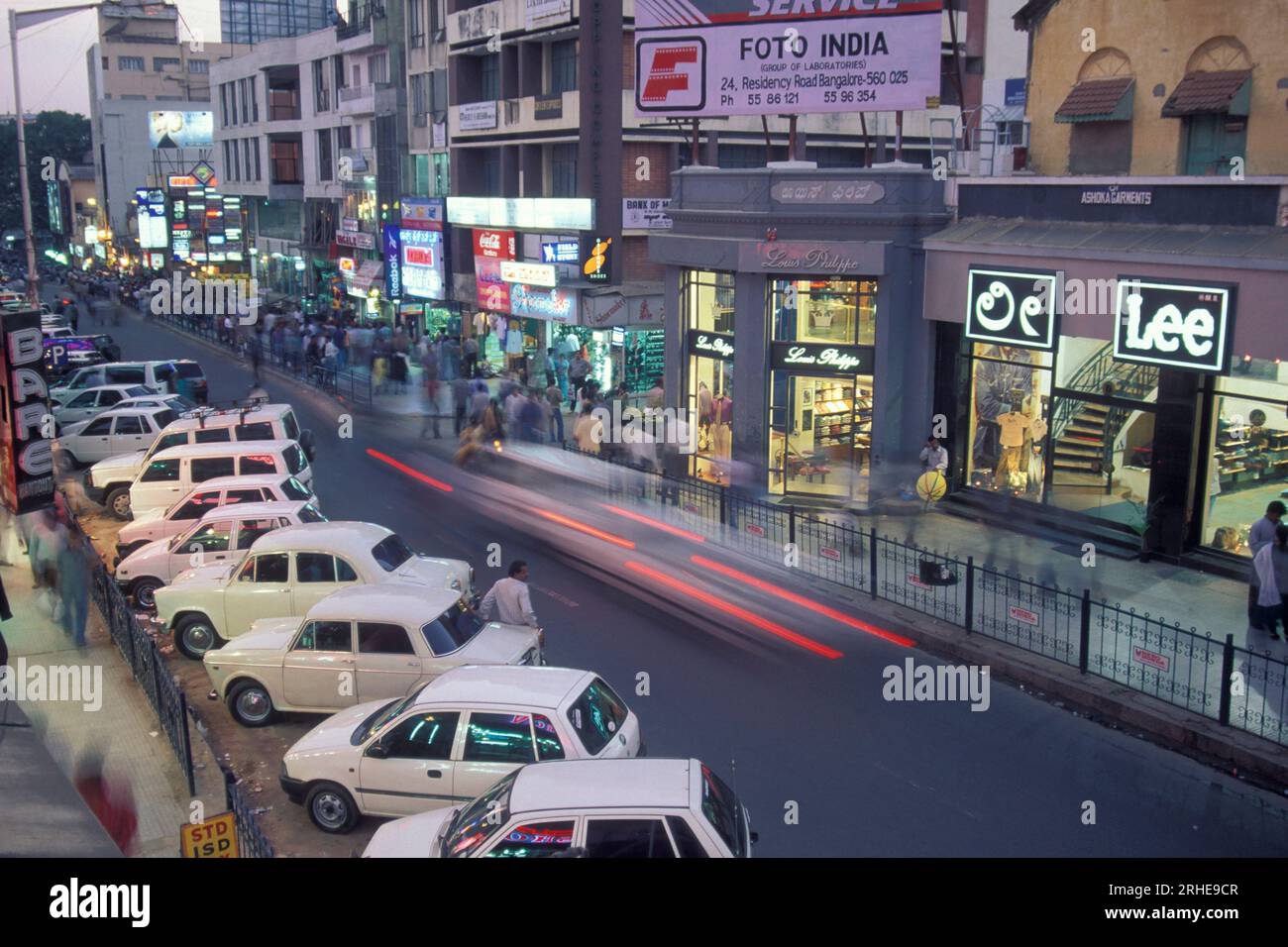 a Shopping street with Shops and People in the city of Bangalore in the ...