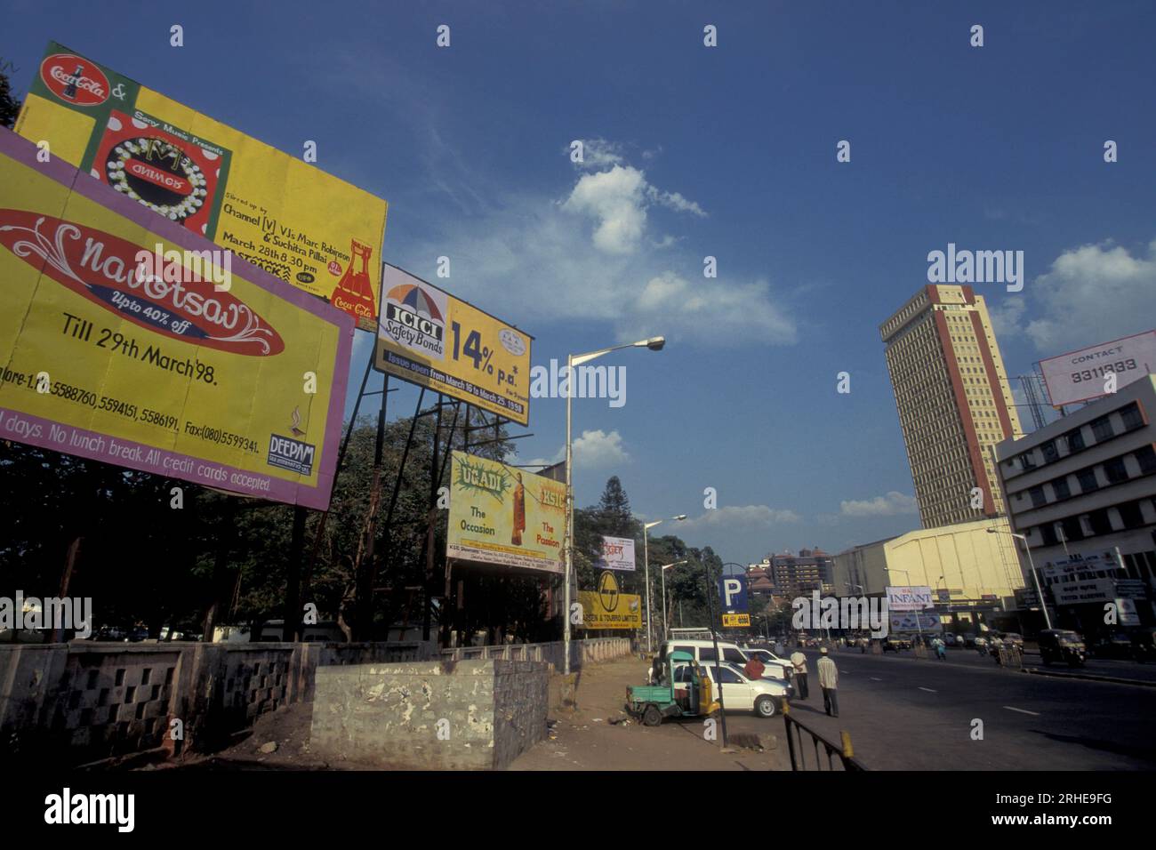 a Shopping street with Shops and People in the city of Bangalore in the ...